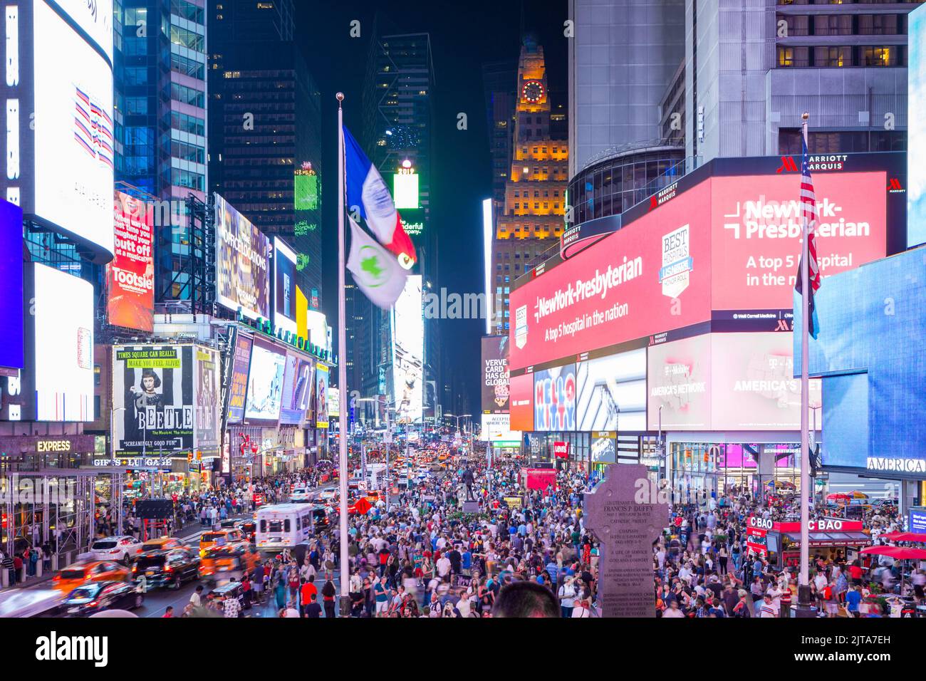 Large crowds gathered by night in Times Square in Midtown Manhattan ...