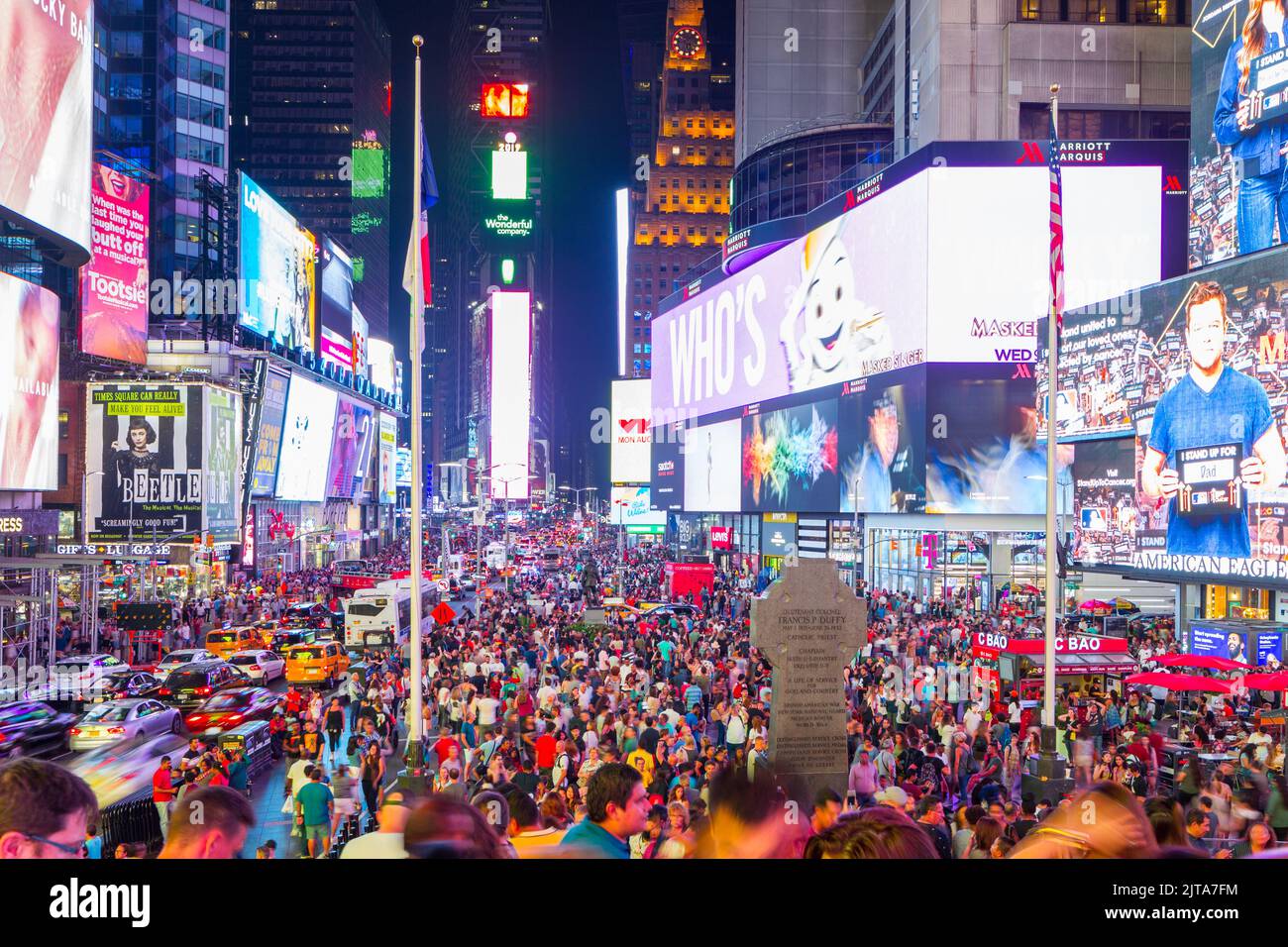 Large crowds gathered by night in Times Square in Midtown Manhattan ...