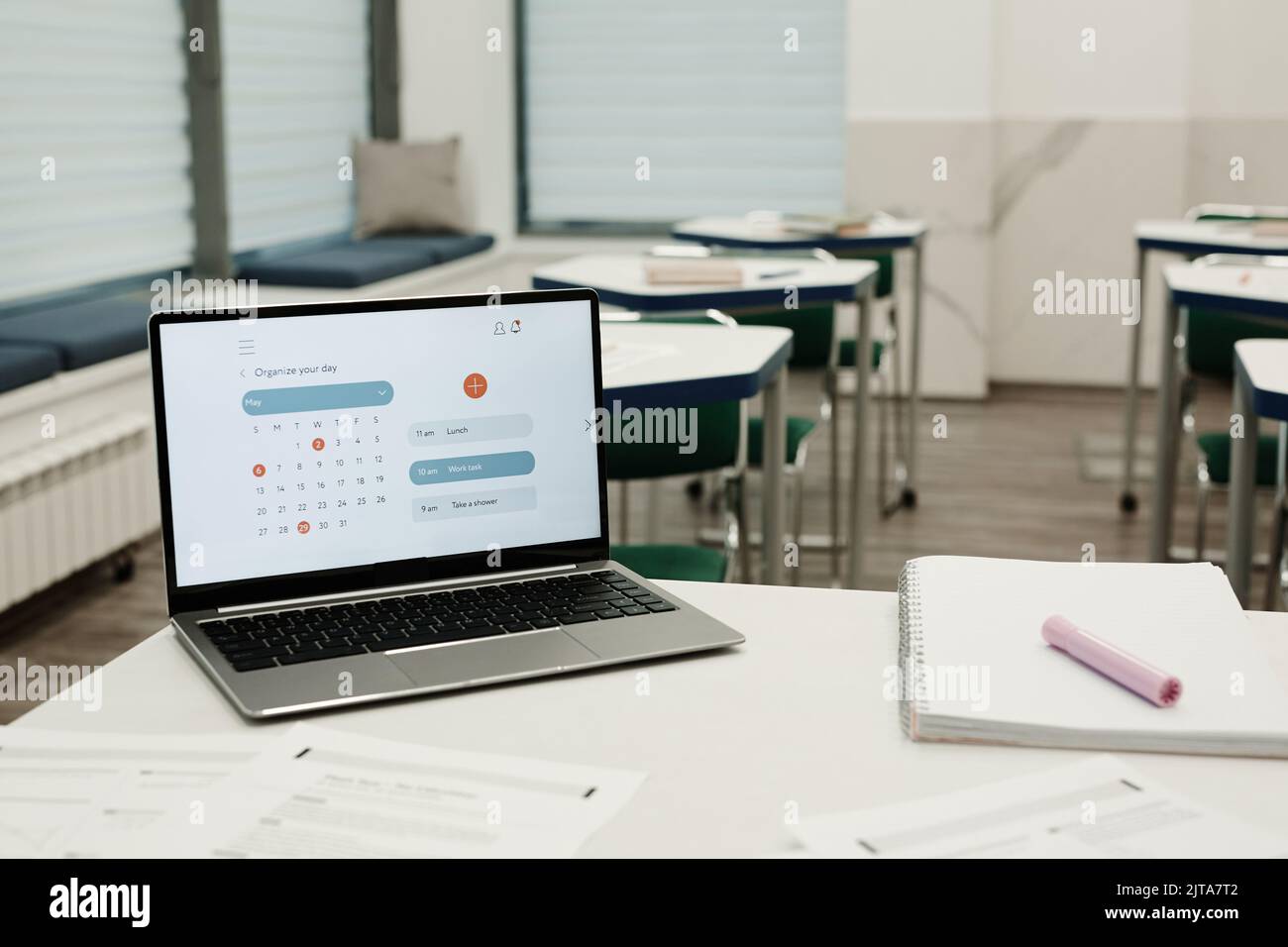 Horizontal image of workplace of teacher with laptop with organizer app ...