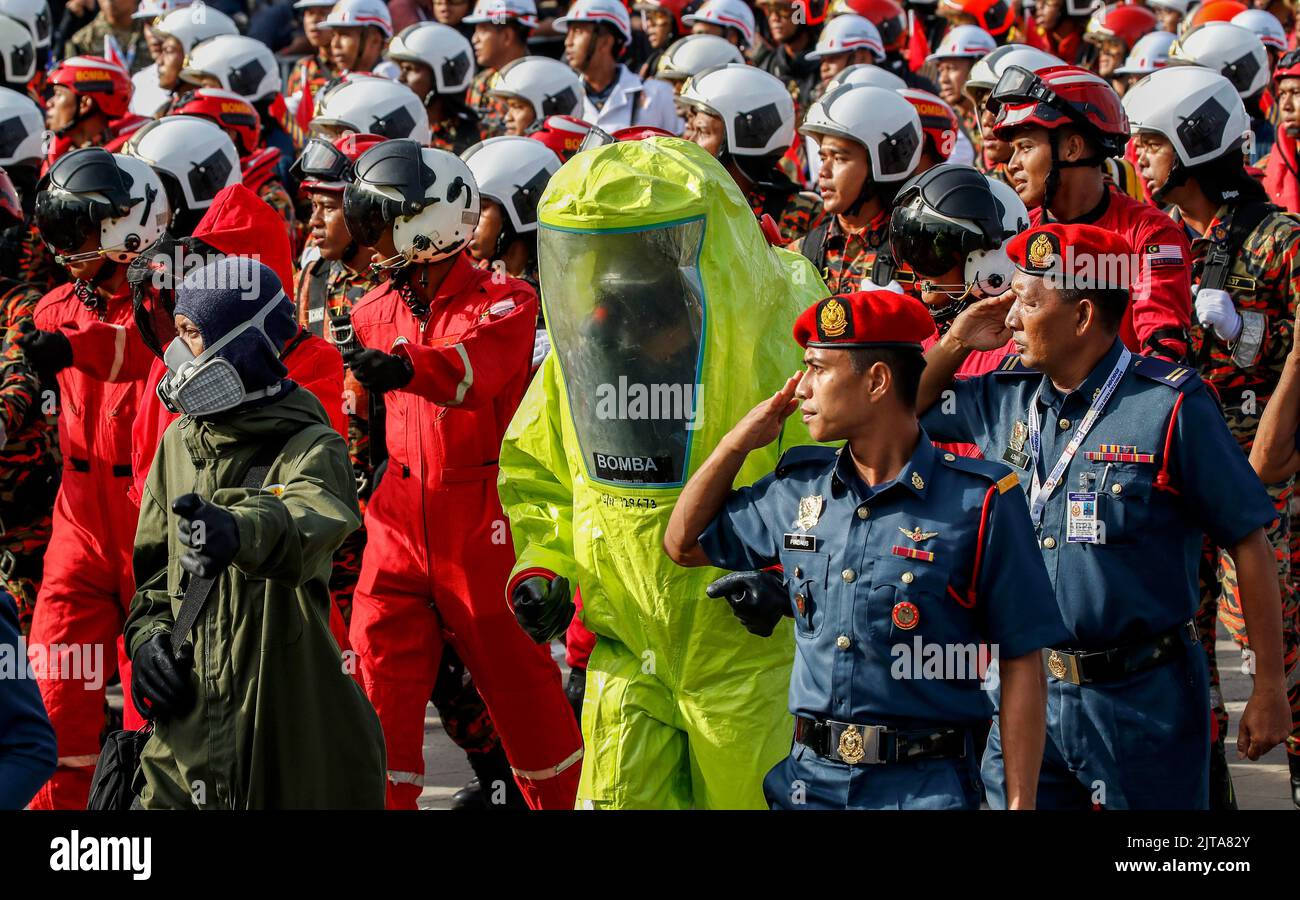 Malaysian Fire and Rescue personnel march during the 65th National Day ...