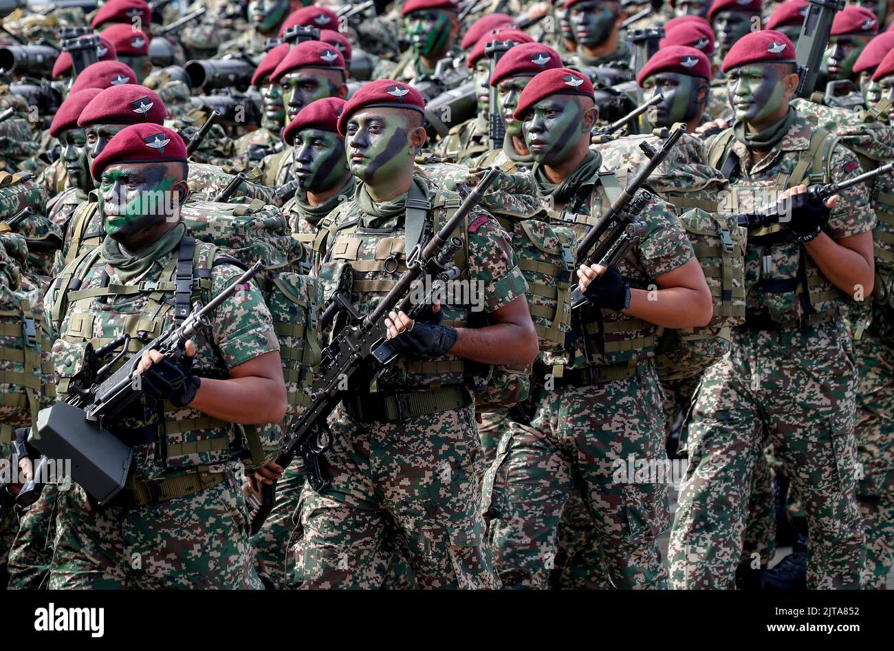 Malaysian Army personnel march during the 65th National Day rehearsal ...