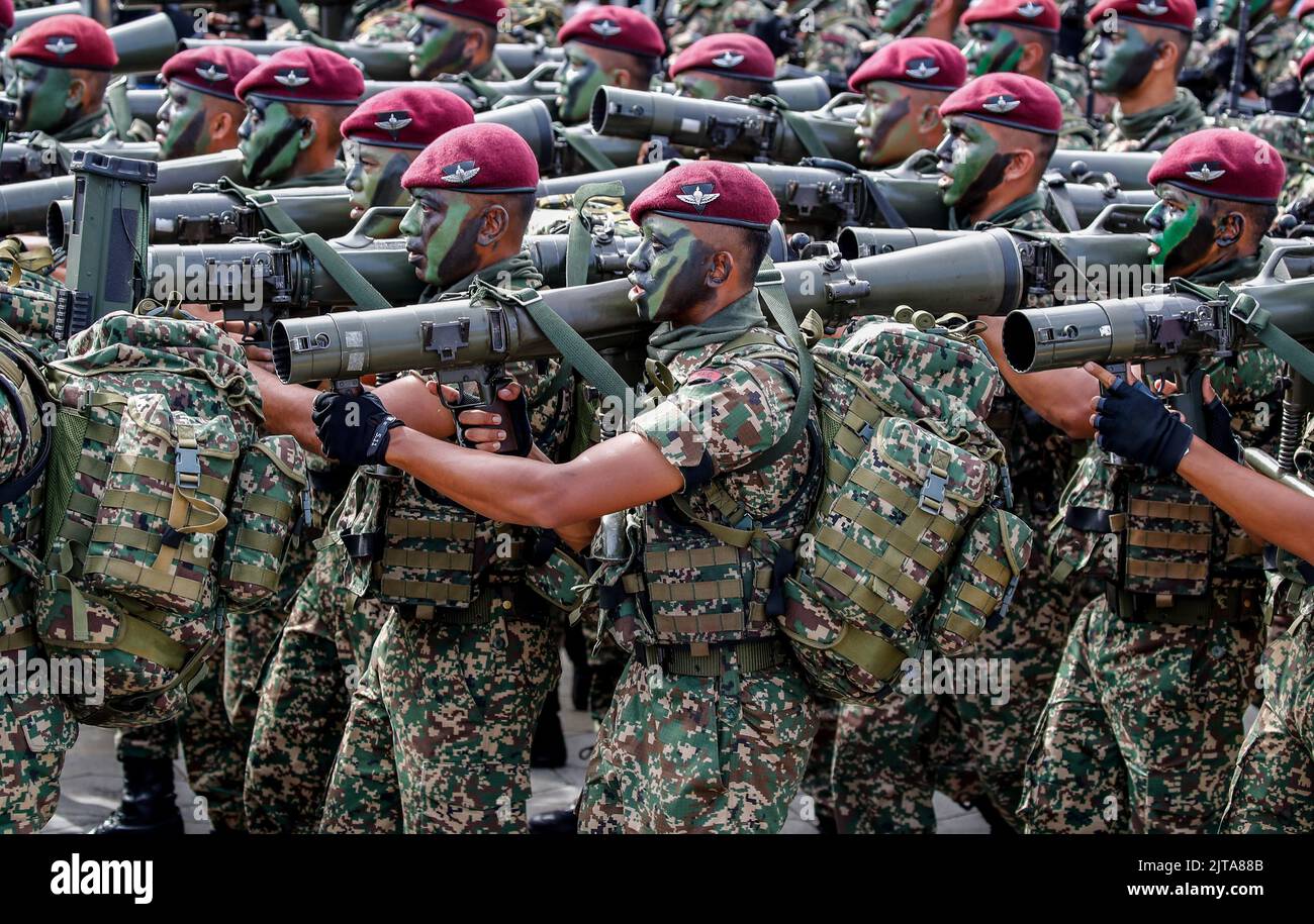Malaysian Army personnel march during the 65th National Day rehearsal ...