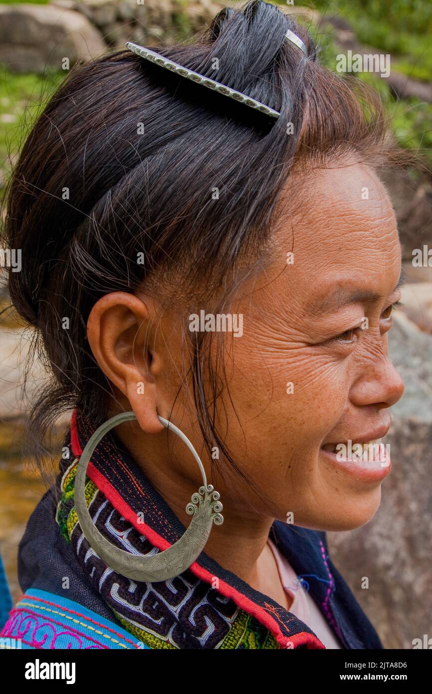 Vietnam, Sapa region. Portrait of a Hmong woman with an traditional ...