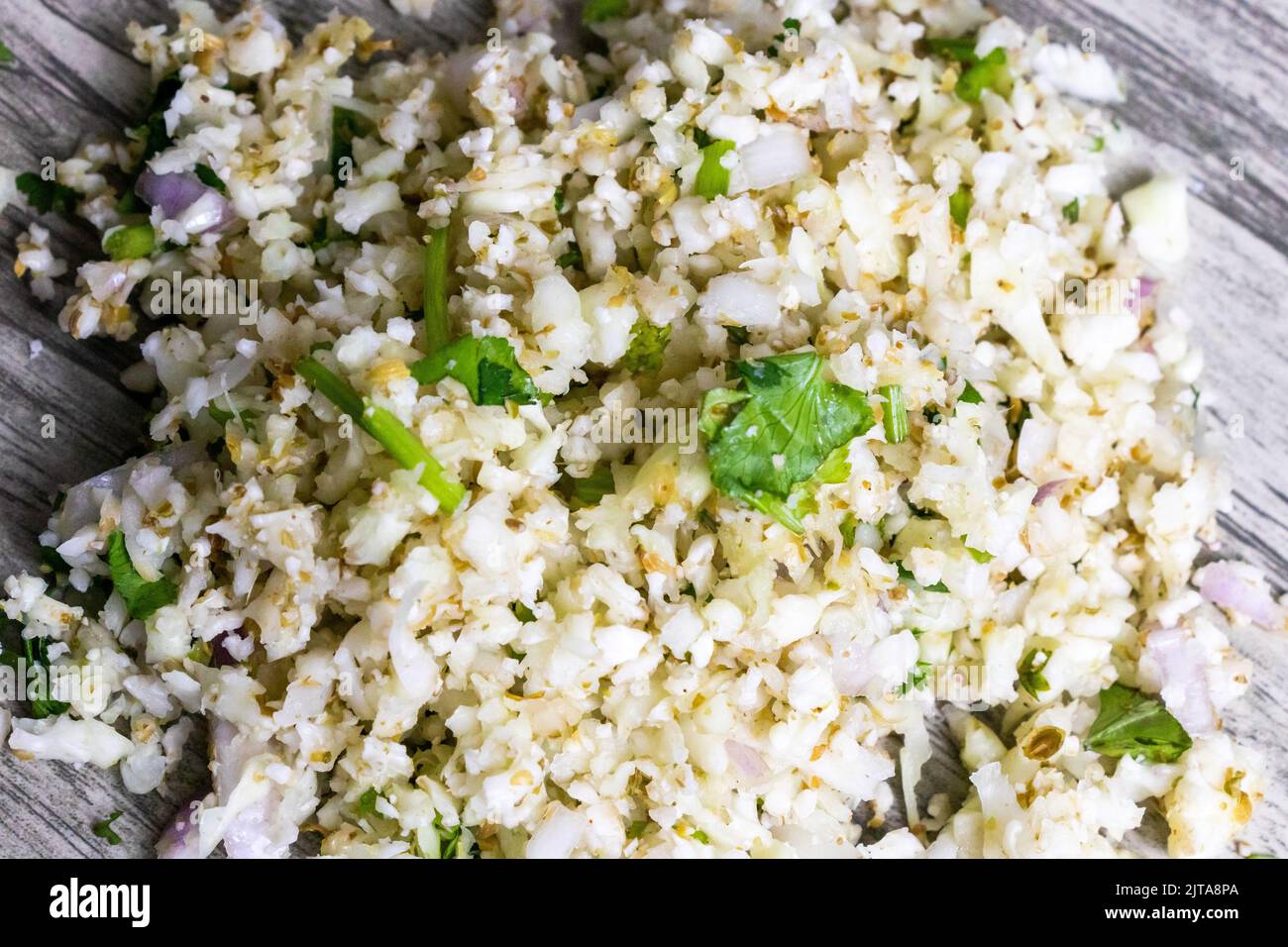 Raw cauliflower rice or grated raw cauliflower. Gobi paratha staffing ...