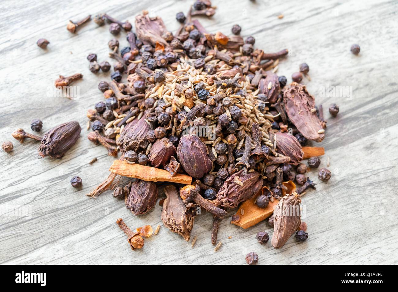 Gram masala Ingredients on wodeen texture background. narrow depth of ...