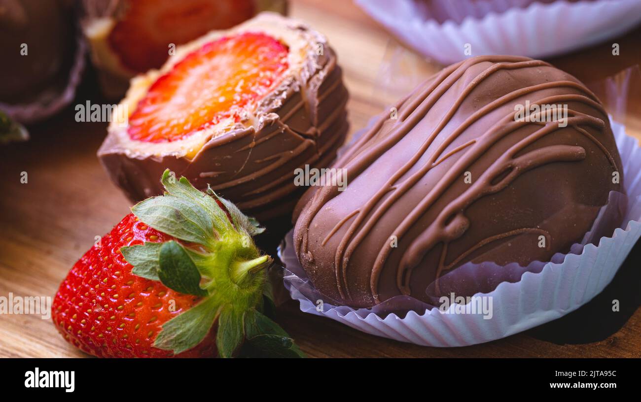 Strawberry bonbon in close-up photo. Brazilian sweet. Brazilian dessert with name in Brazilian ...