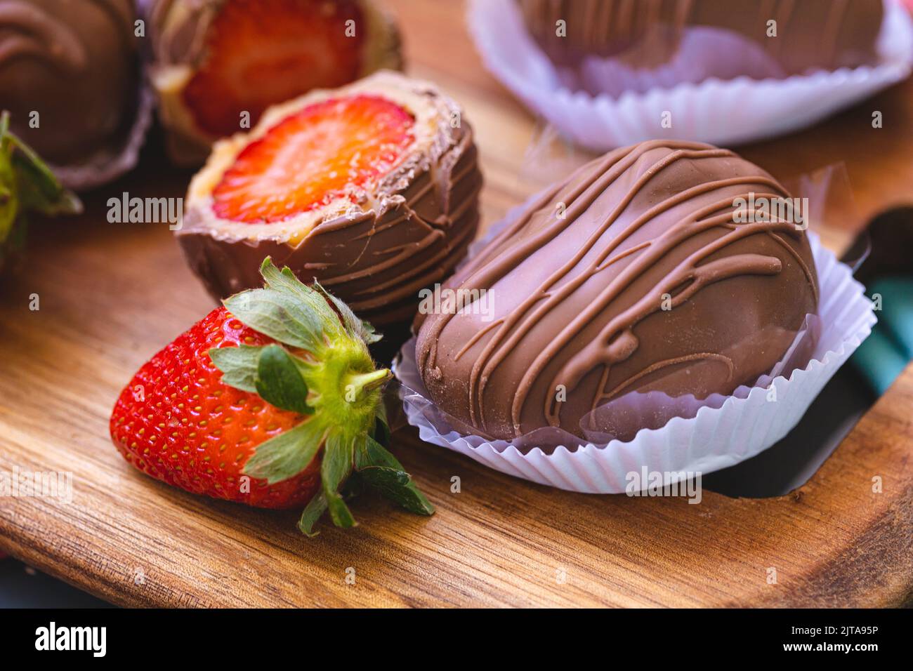 Strawberry bonbon in close-up photo. Brazilian sweet. Brazilian dessert with name in Brazilian ...