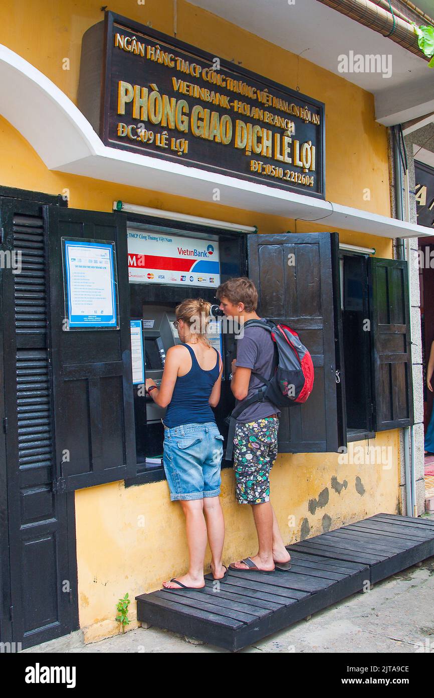 Vietnam, Hoi An Tourists at an ATM to get money Stock Photo - Alamy