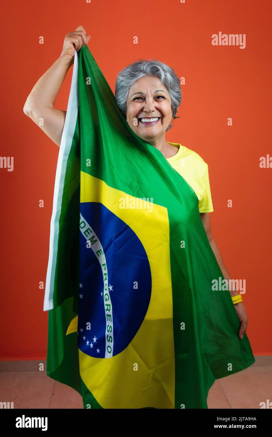 Brazil Independence Day - Mature Woman with Gray Hair, yellow shirt and ...