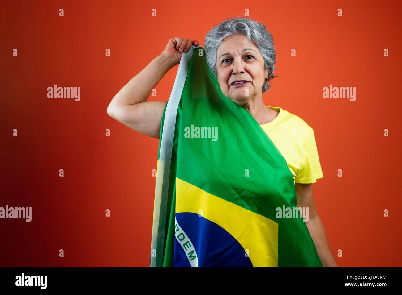 Brazil Independence Day - Mature Woman with Gray Hair, yellow shirt and ...