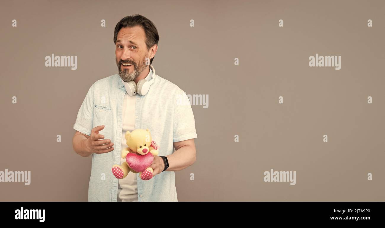 You need present for Valentines day. Old man smile holding teddy bear ...