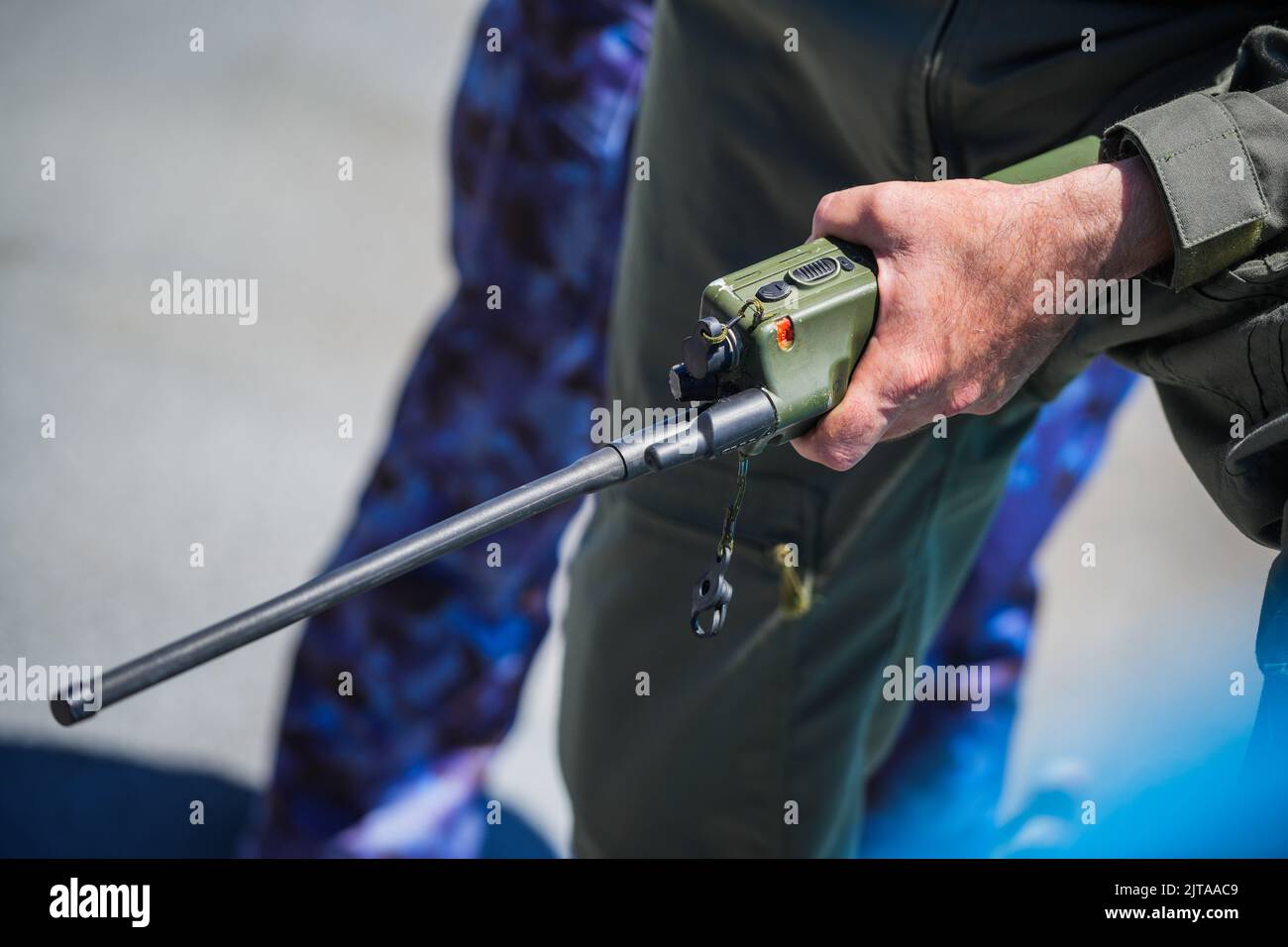 Hand holding a portable radio transceiver walkie talkie Stock Photo - Alamy