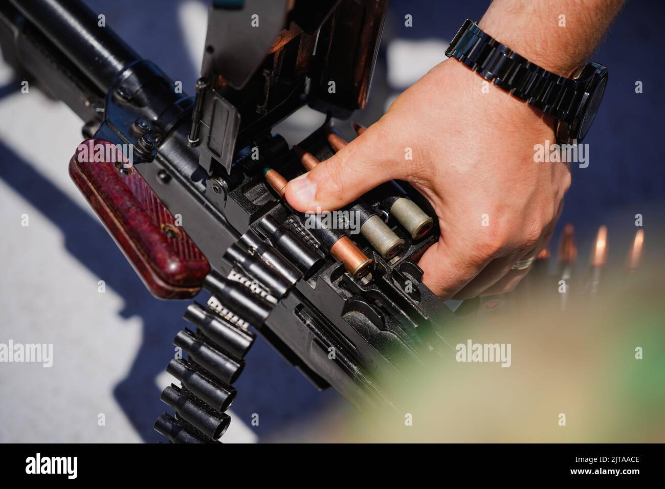 Close up shot of a machine gun belt loaded with cartridges Stock Photo ...
