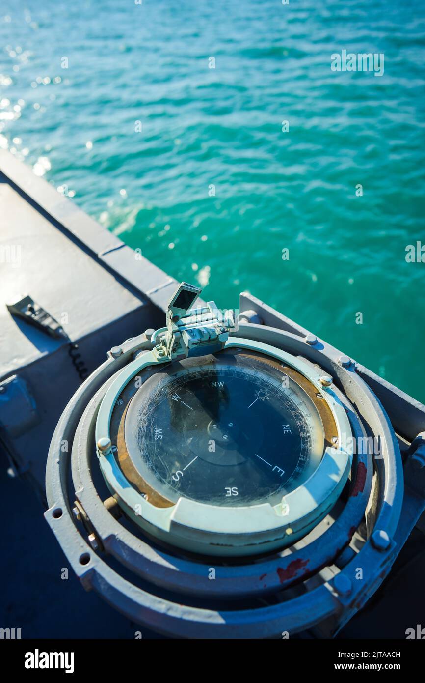 Image of the compass on a military ship sailing on the sea Stock Photo ...