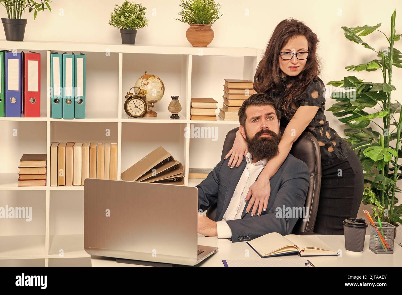 Acting on her feelings. Female boss flirting with male employee ...