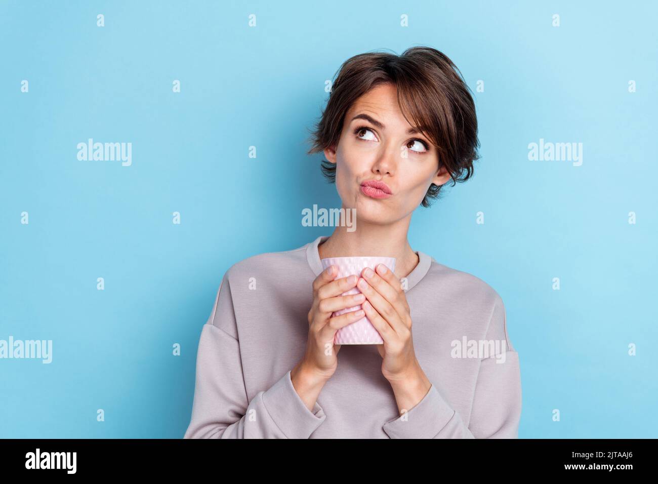 Photo of pretty minded lady stylish outfit eyes look up empty space hmm ...