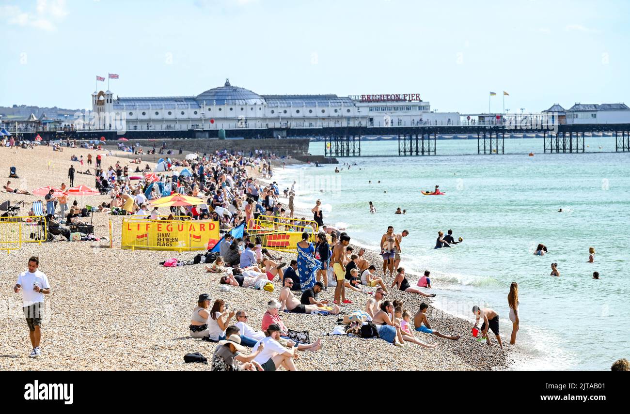 Brighton UK 29th August 2022 - Visitors enjoy the sunshine on Brighton ...
