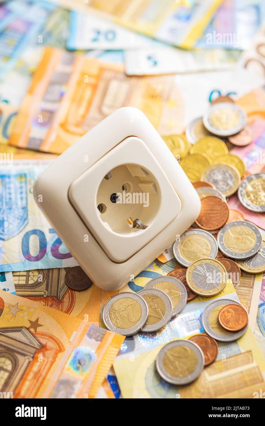 Electric socket and euro money. Concept of the increasing electricity ...