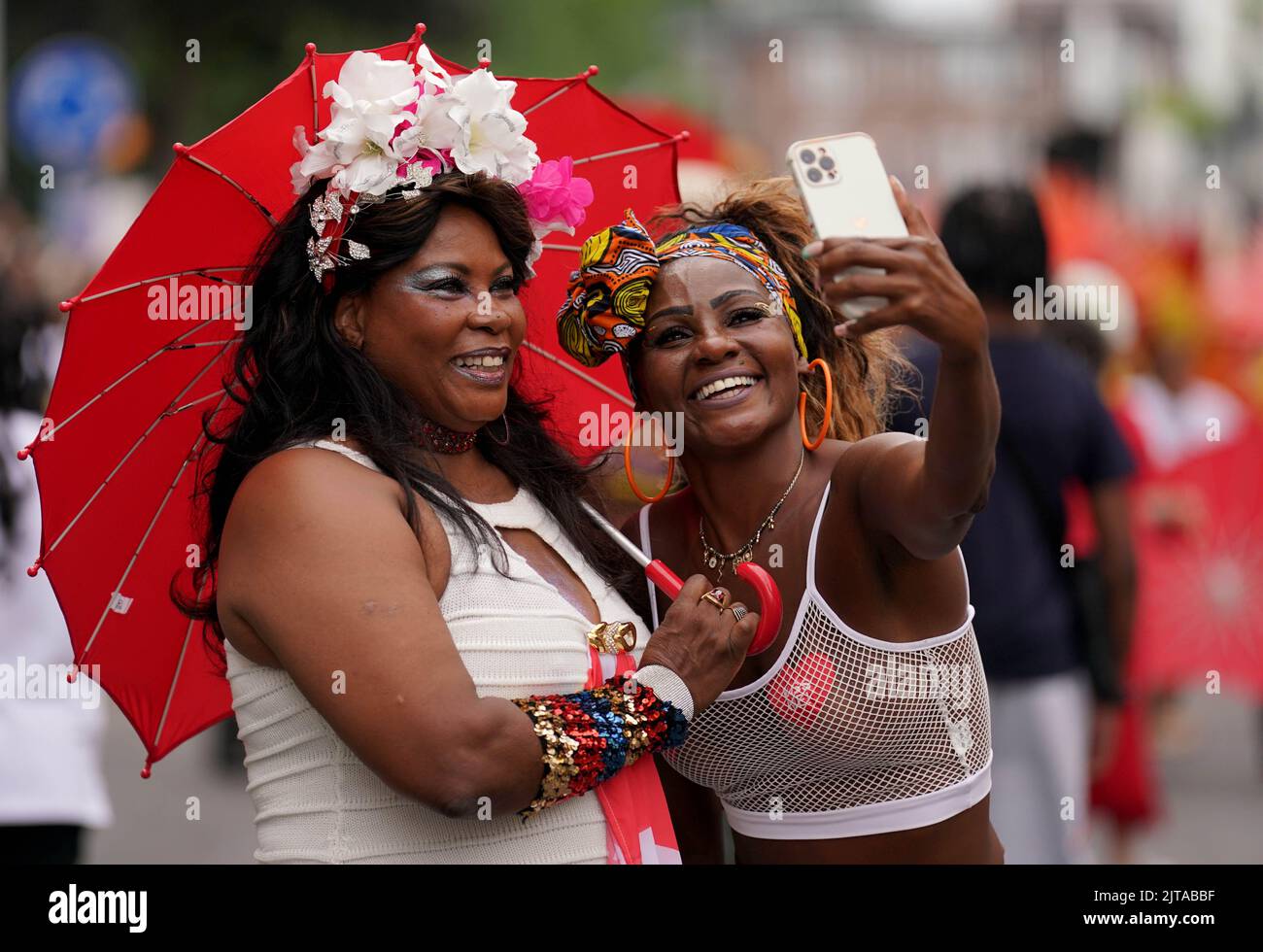 Carnival-goers take a selfie at the Notting Hill Carnival in London ...