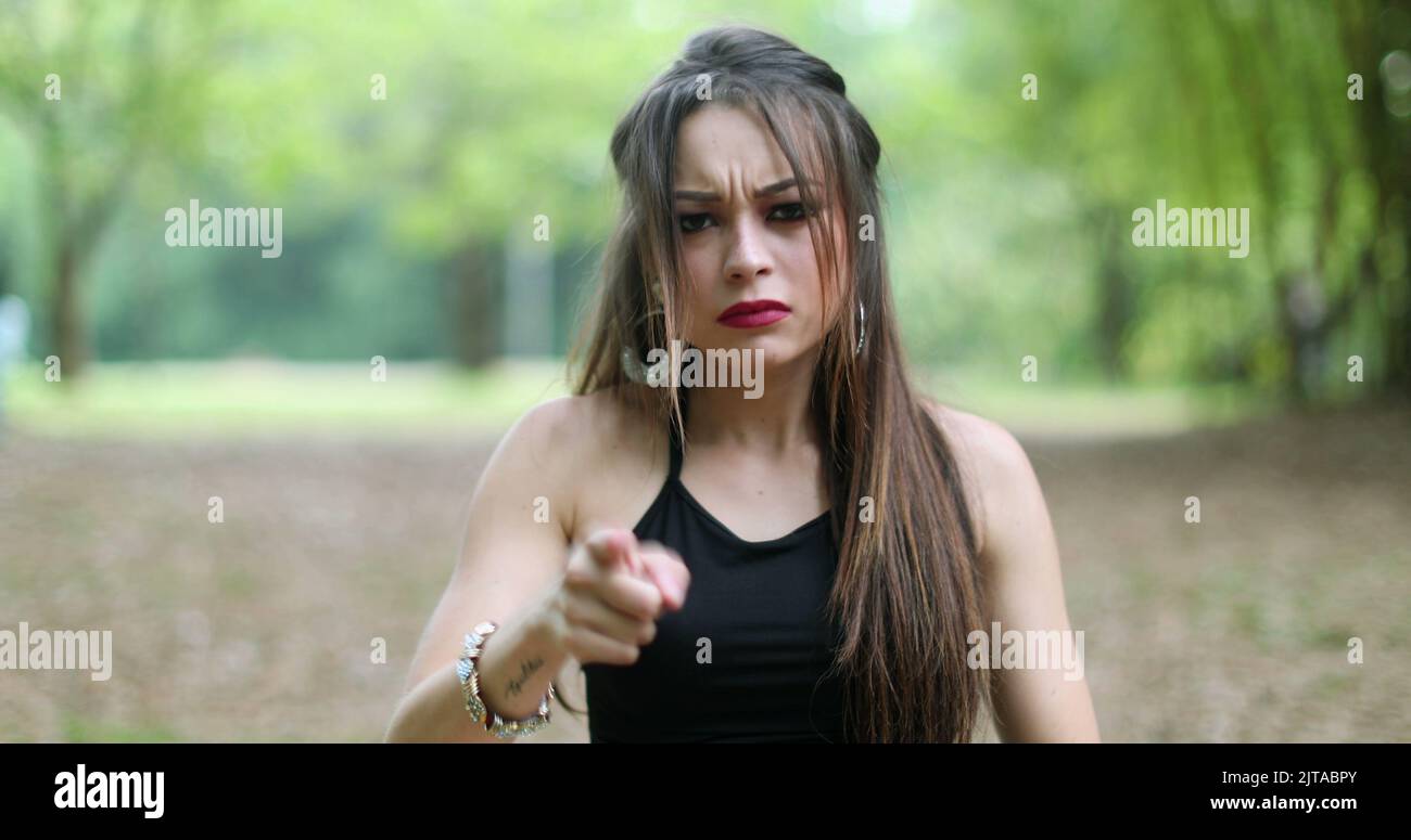 Angry young woman pointing finger to camera, upset unhappy girl shaking ...