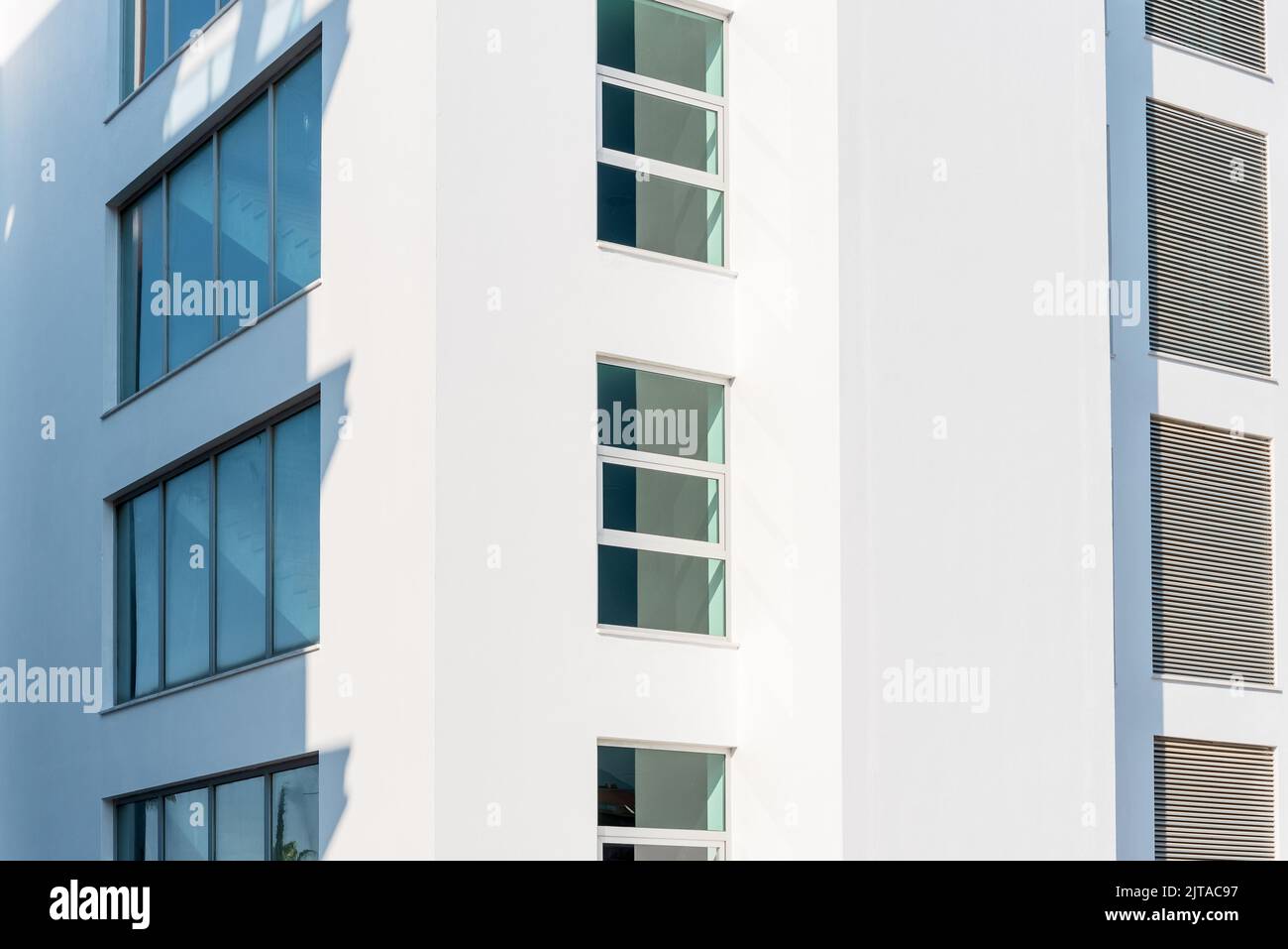 Close-up of the facade of a white building with windows. Hospital ...