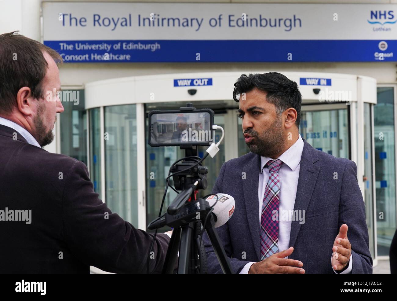 Scottish Health Secretary Humza Yousaf speaks to the media following a ...
