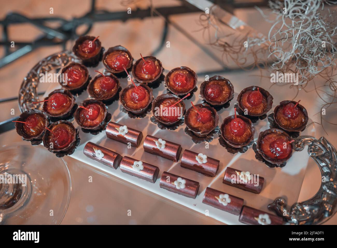 A high-angle shot of different types of candy on a fancy plate Stock ...