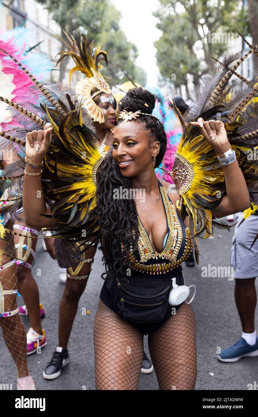 EDITORIAL USE ONLY Alexandra Burke appears alongside The Utopia Band wearing an Elvie Stride ...