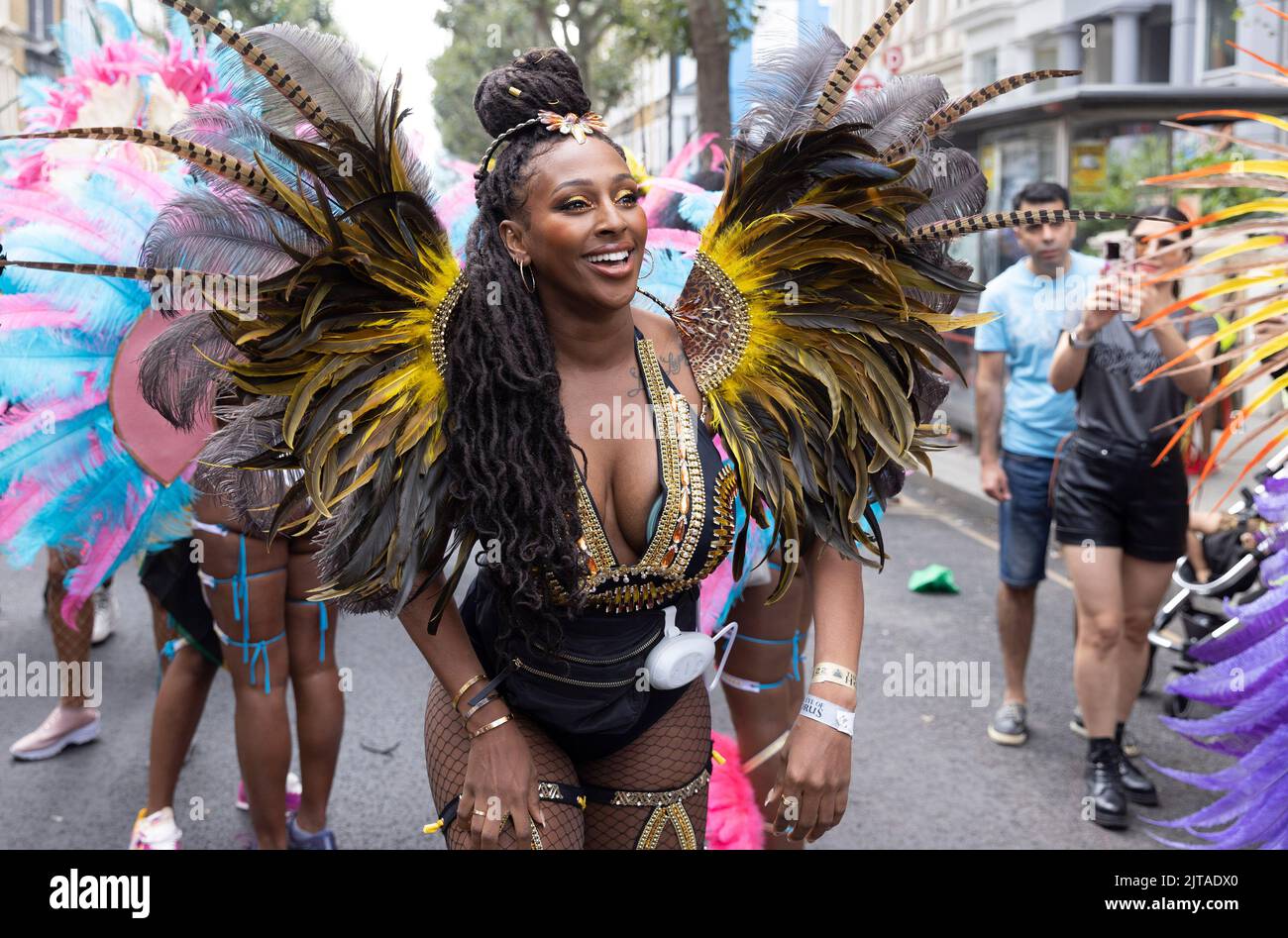 EDITORIAL USE ONLY Alexandra Burke appears alongside The Utopia Band wearing an Elvie Stride ...