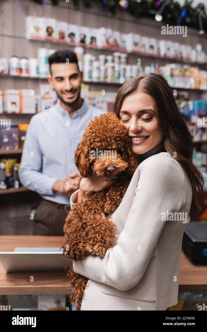 Smiling woman hugging poodle hi-res stock photography and images - Alamy