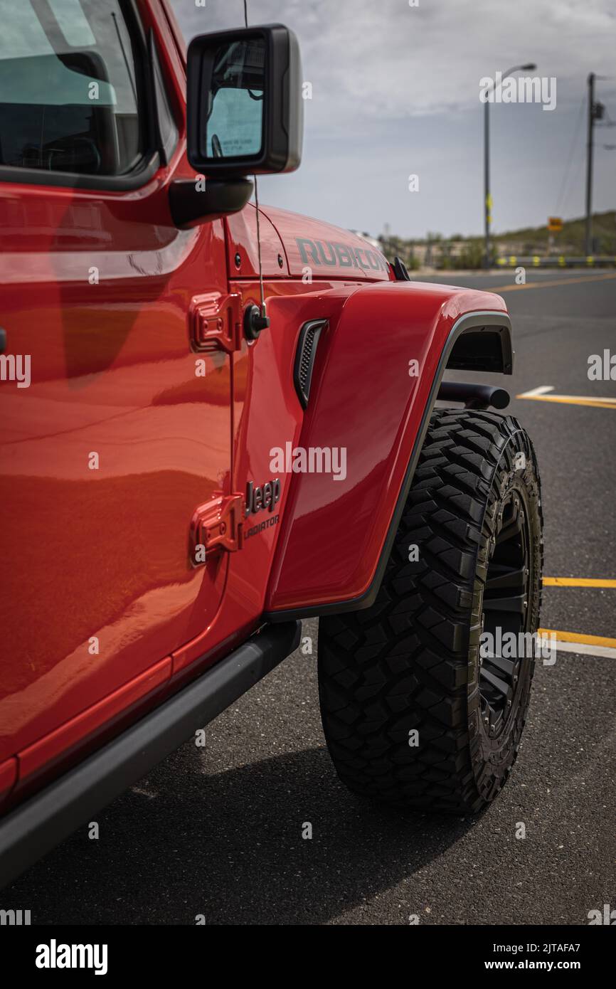 A vertical shot of a red jeep wrangler on a driveway Stock Photo - Alamy