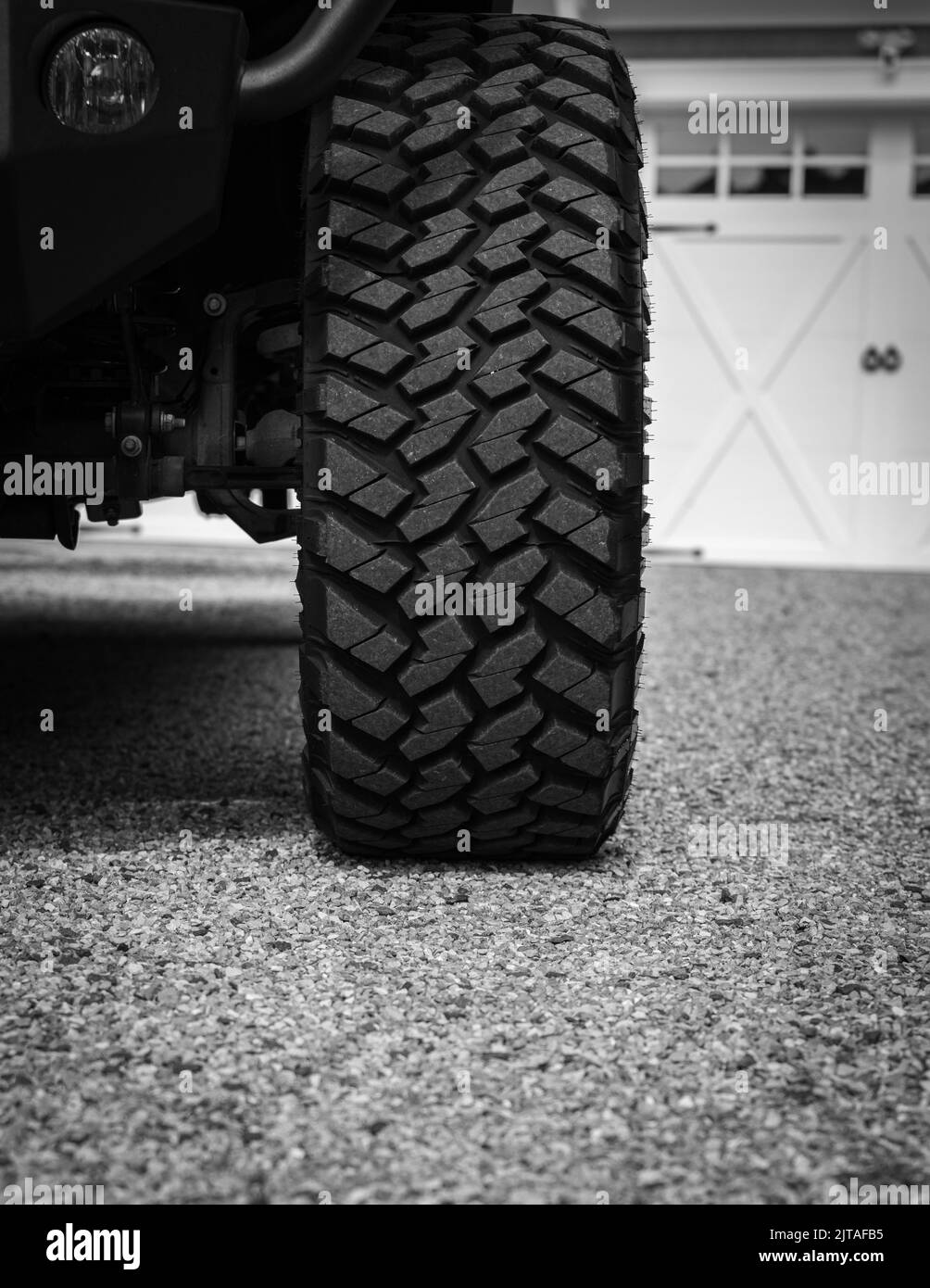 A grayscale shot of the wheel of an off road vehicle Stock Photo - Alamy