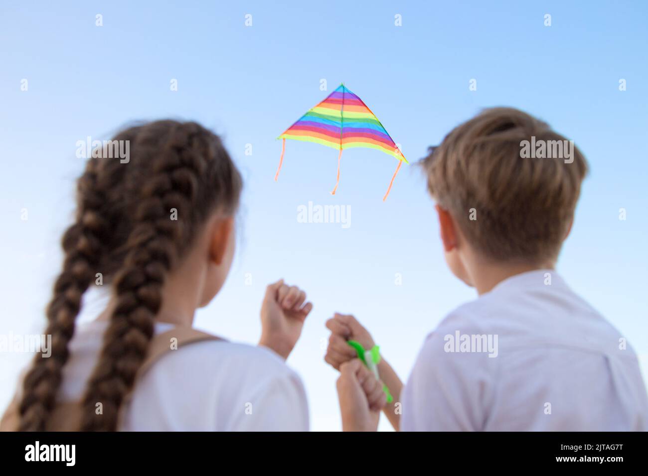 Boy girl stand back back hi-res stock photography and images - Alamy