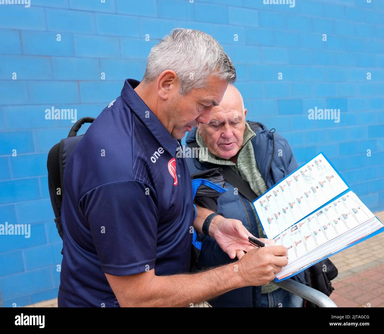 Daryl Powell Head Coach of Warrington Wolves signs autographs as he ...