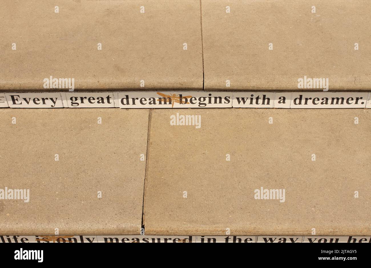 Inspirational quotes marked on the stairs Stock Photo - Alamy