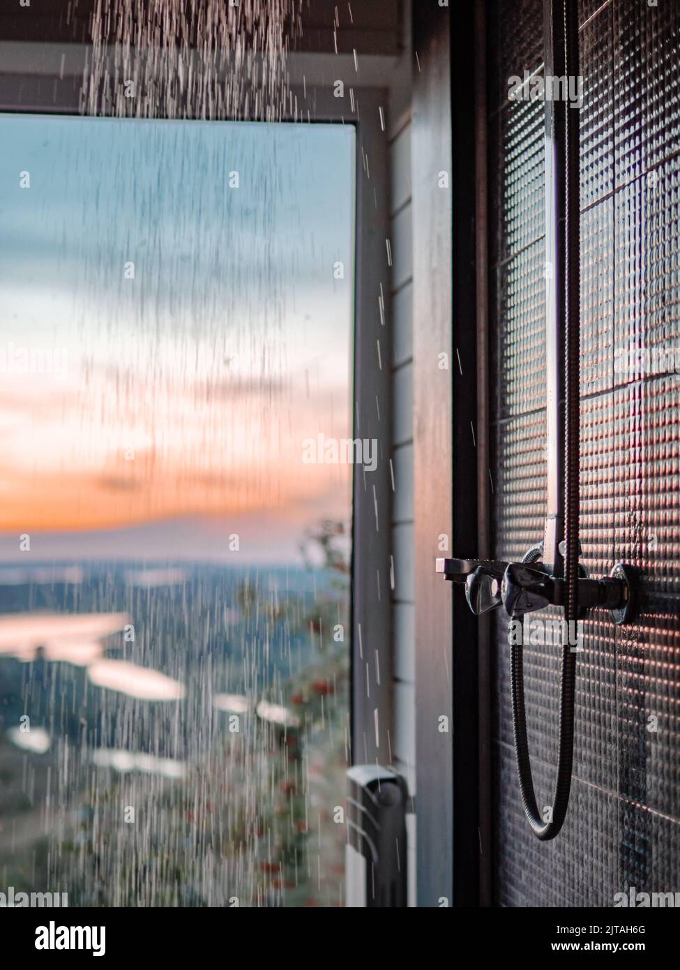Bathing room interior with panoramic window. Splashes and drops of ...