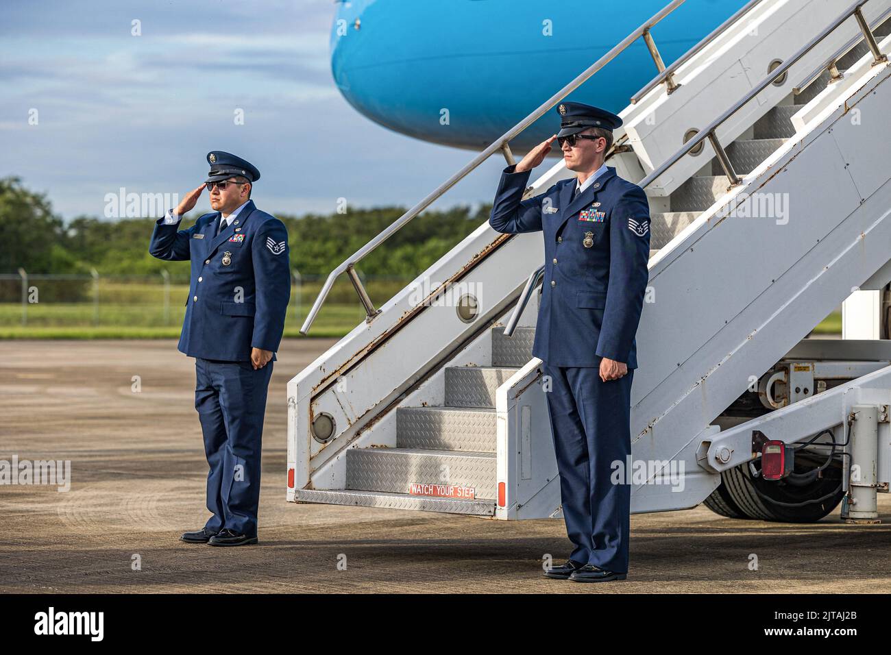 Kennedy Space Center, Florida, Aug. 29, 2022. Two men salute as Vice ...