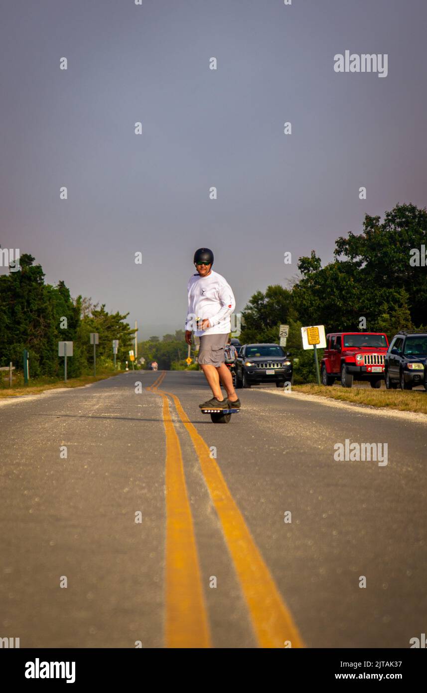 A vertical shot of a man riding a one wheel in Everett, United States ...