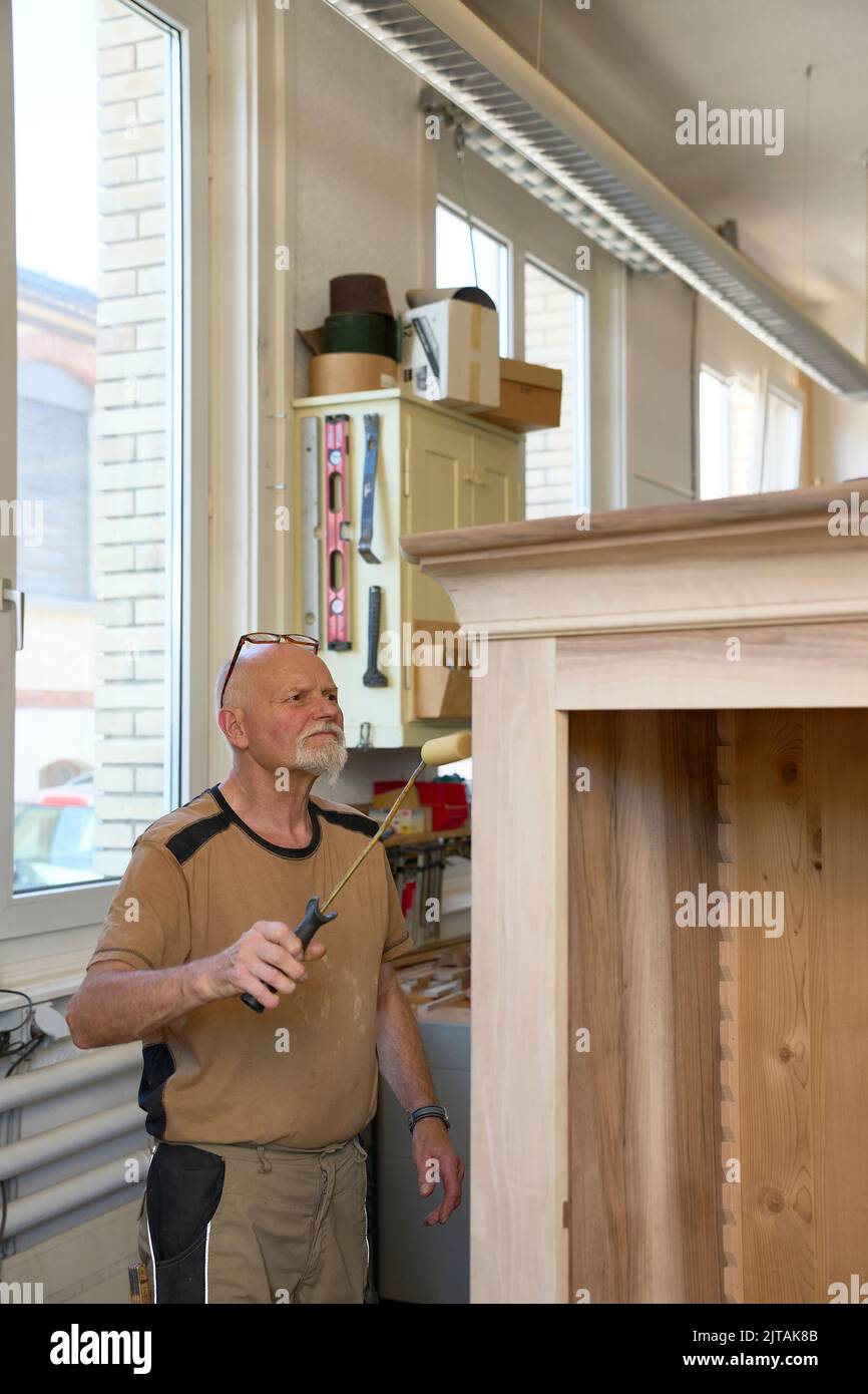 A beautiful shot of a Caucasian carpenter working in his workshop Stock ...