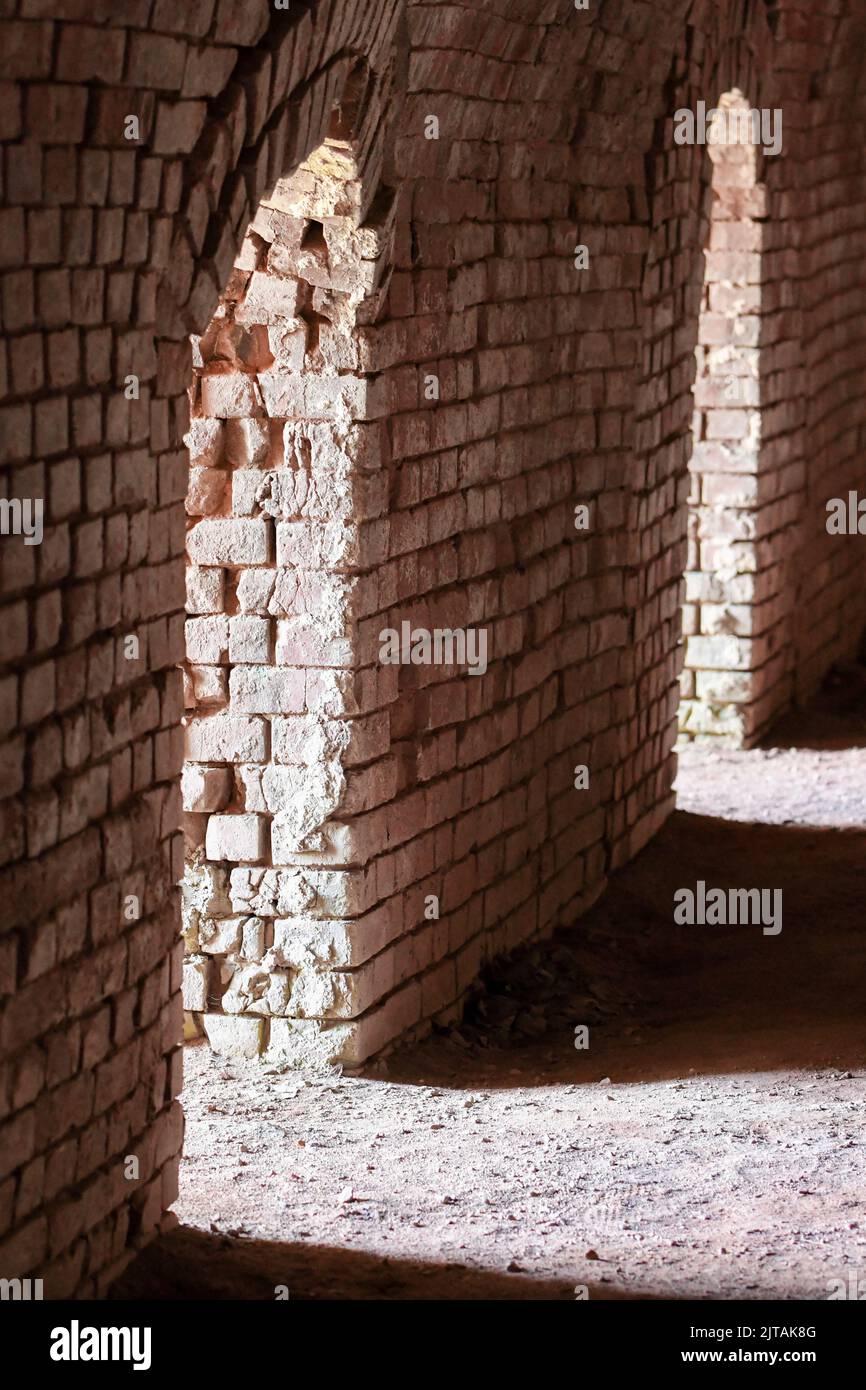 Photo of several archways inside a building, light and shadow Stock ...