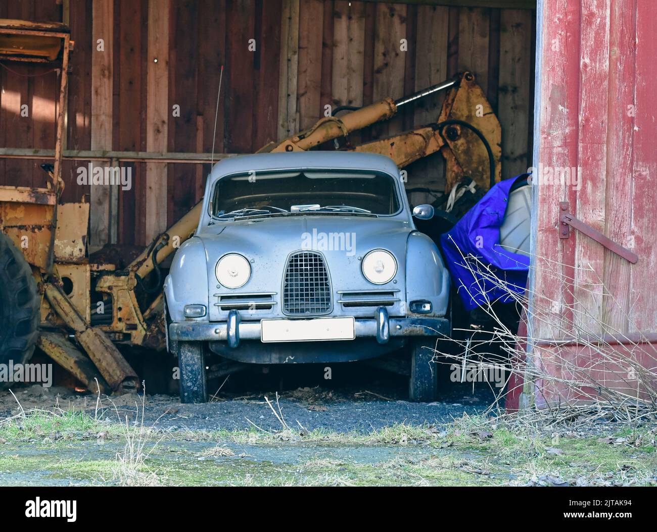 Photo of an old retro car in an open garage Stock Photo - Alamy