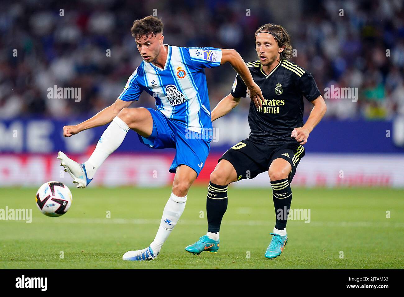 Javi Puado of RCD Espanyol and Luka Modric of Real Madrid during the La ...