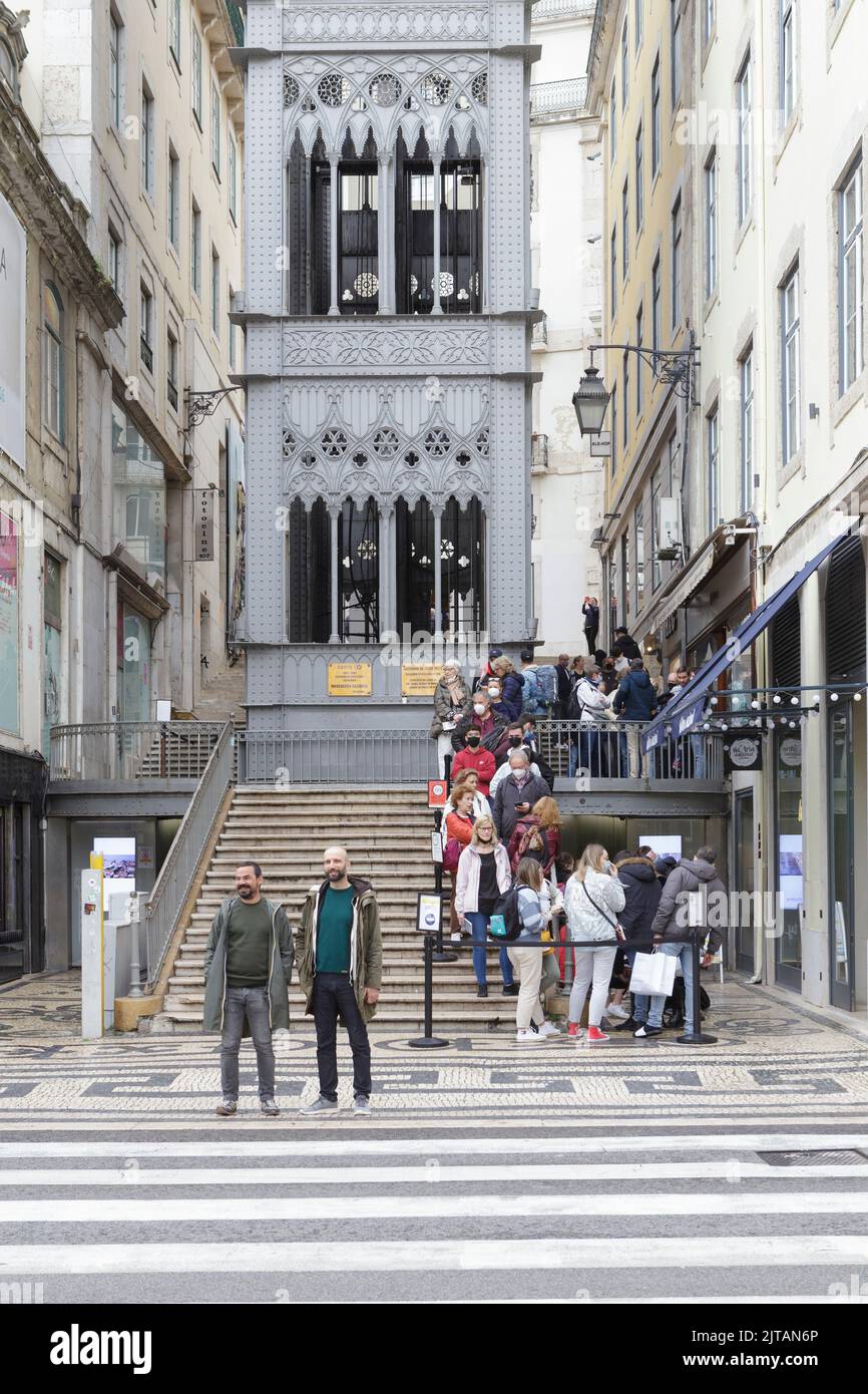 Tourists waiting to take the lift up on the elevador de santa Justa ...