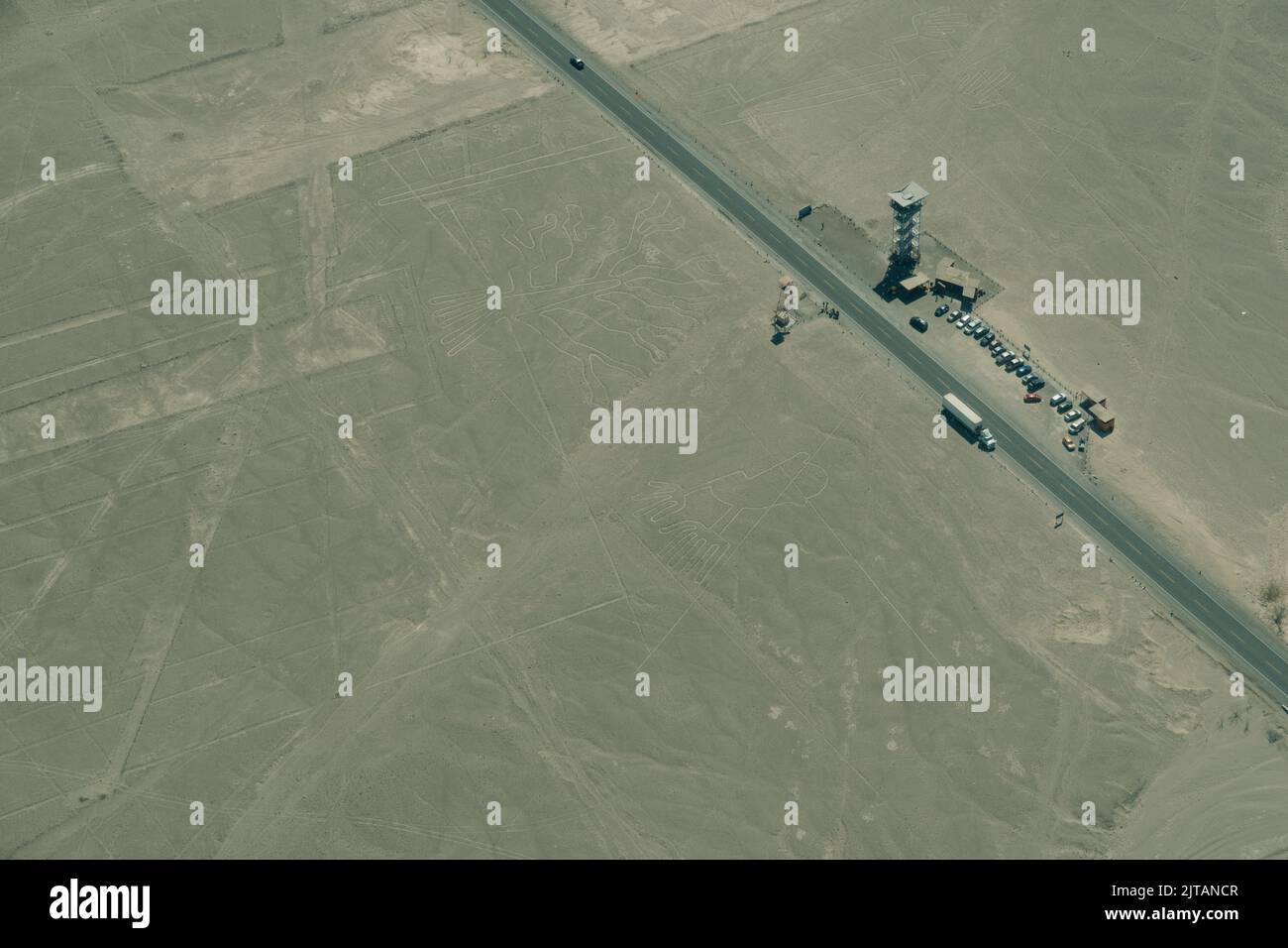 A beautiful shot of cars in Nazca Condor Lines Geoglyphs in the Nasca ...