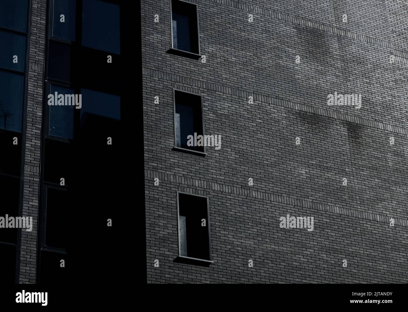 City housing of dark brick exterior in a modern style of architecture ...