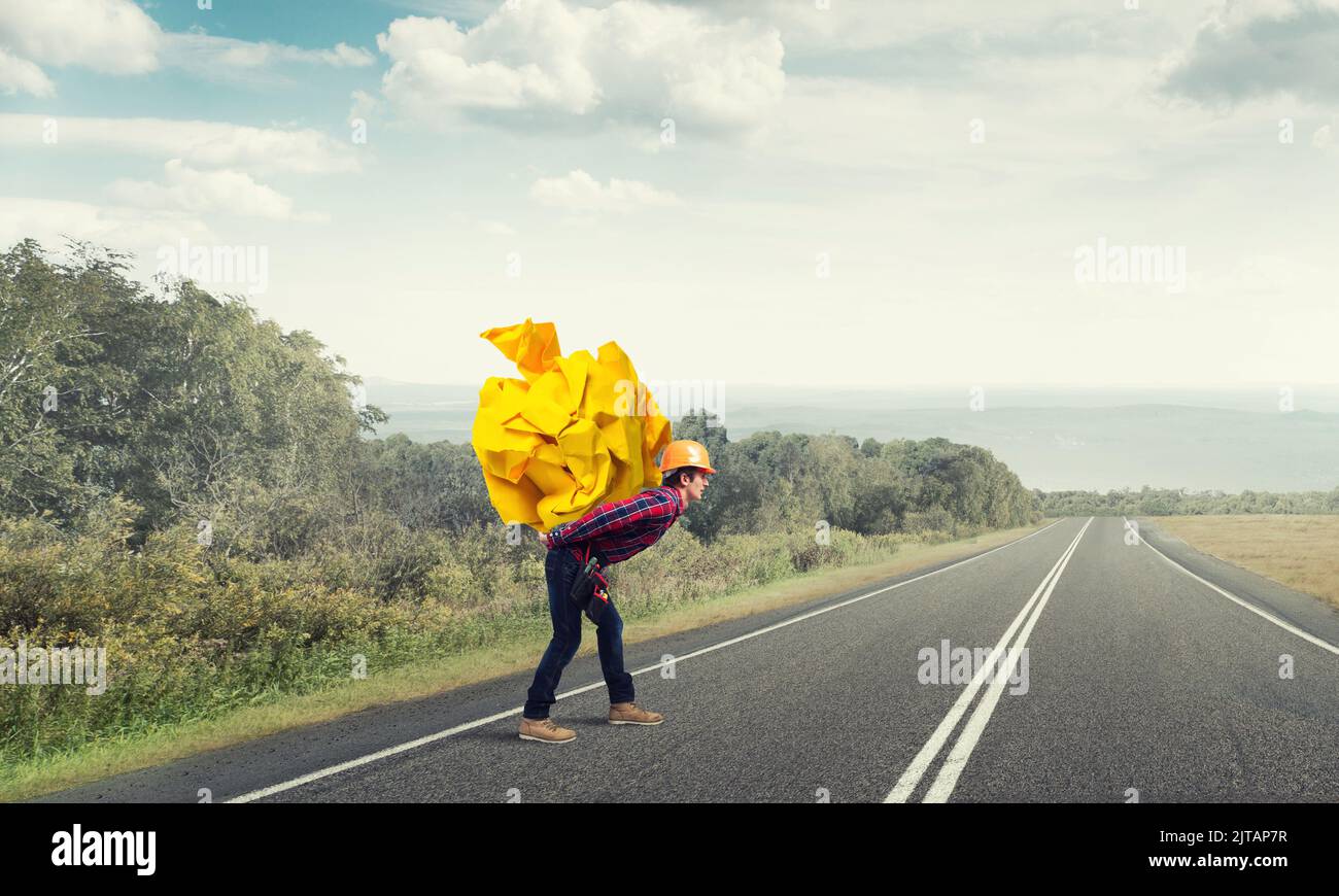 Engineer man carry load Stock Photo - Alamy