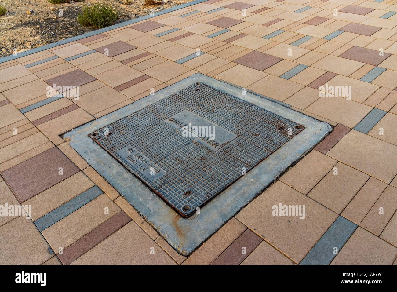 Close up shot of a chilled water manhole Stock Photo - Alamy