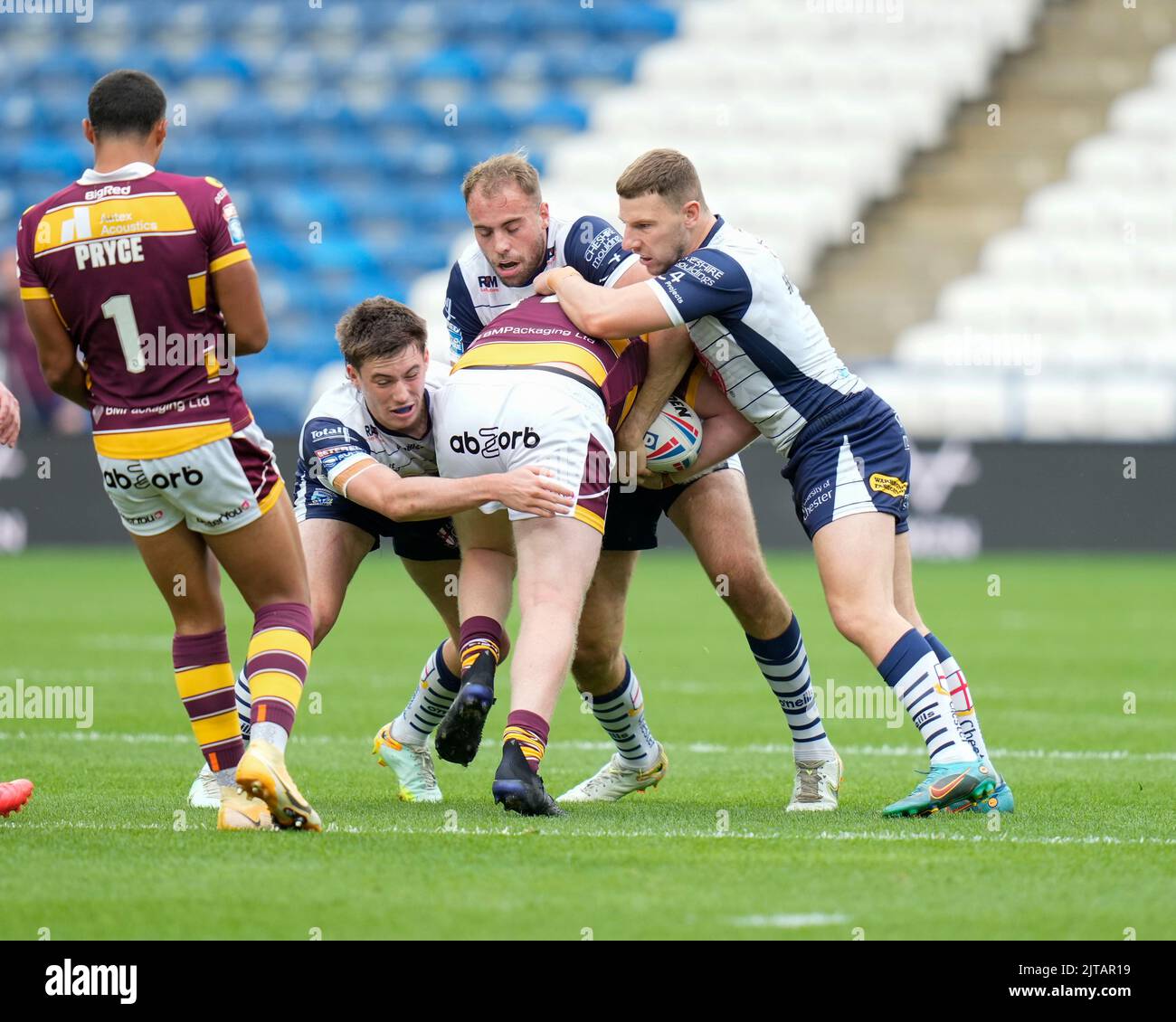 James Harrison #20 and George Williams of Warrington Wolves make a ...