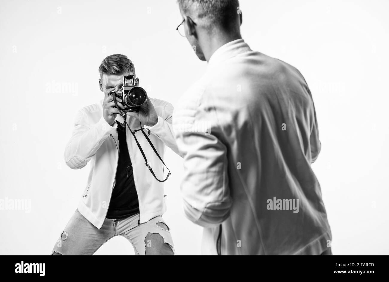 young twin brothers photographer with similar appearance make photo ...