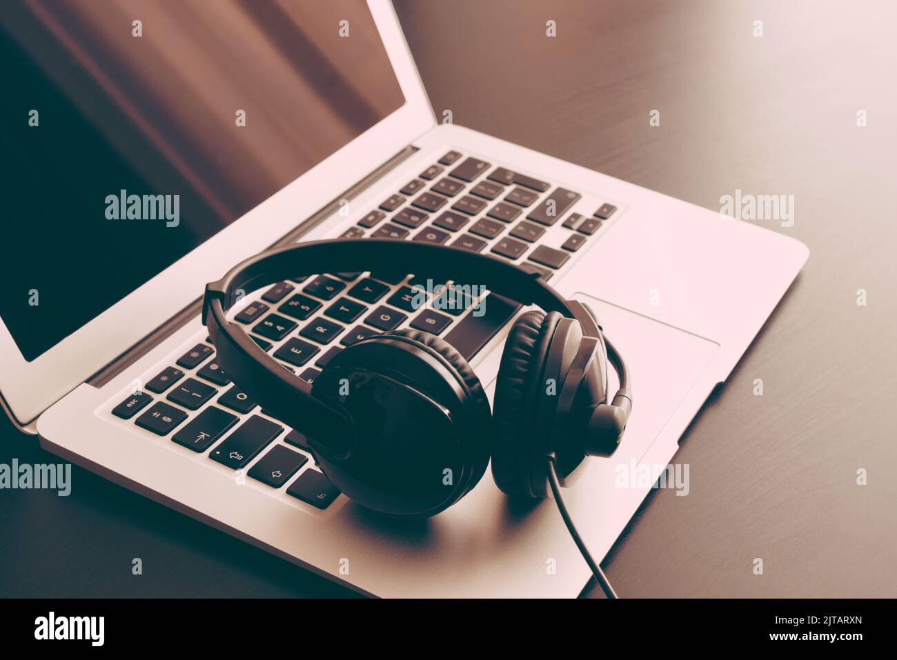 Headset and laptop on desk, call center, helpdesk concept Stock Photo ...